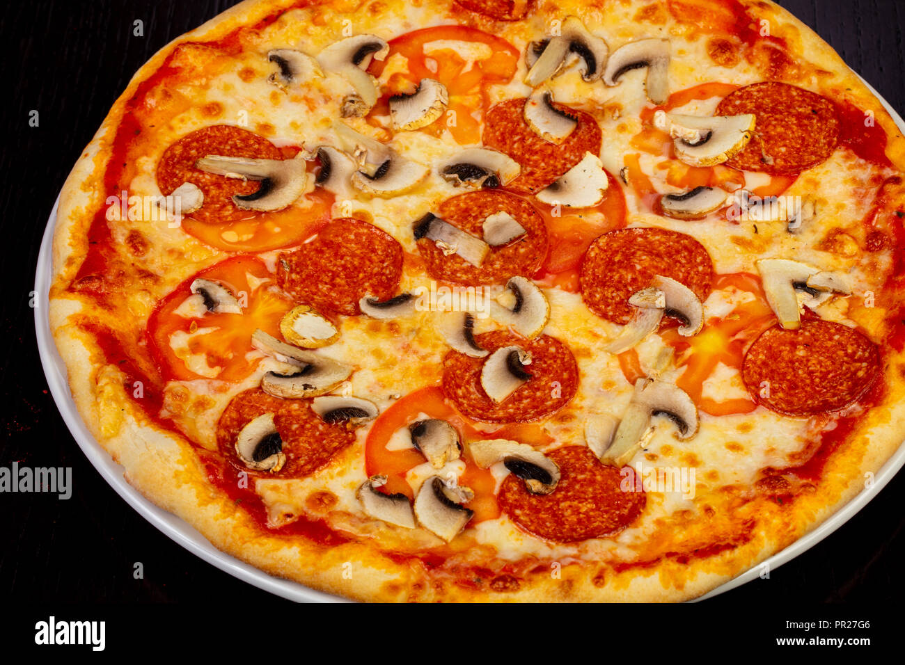 Delicious pepperoni pizza with mushrooms Stock Photo - Alamy