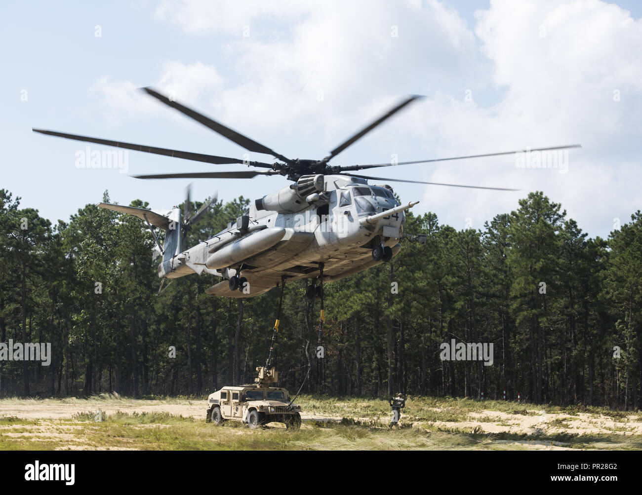 A U.S. Marine Corps CH-53E Super Stallion begins to lift a U.S. Army ...