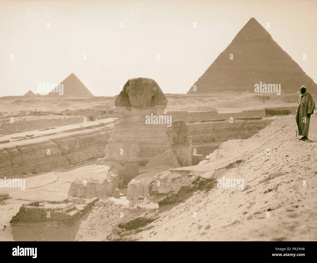 Egypt. Sphinx & pyramids. Sphinx (front view with two pyramids in ...