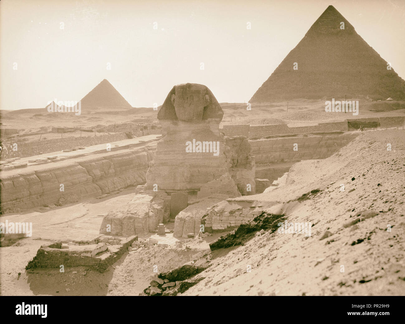 Egypt. Sphinx & pyramids. Sphinx (front view with two pyramids in ...