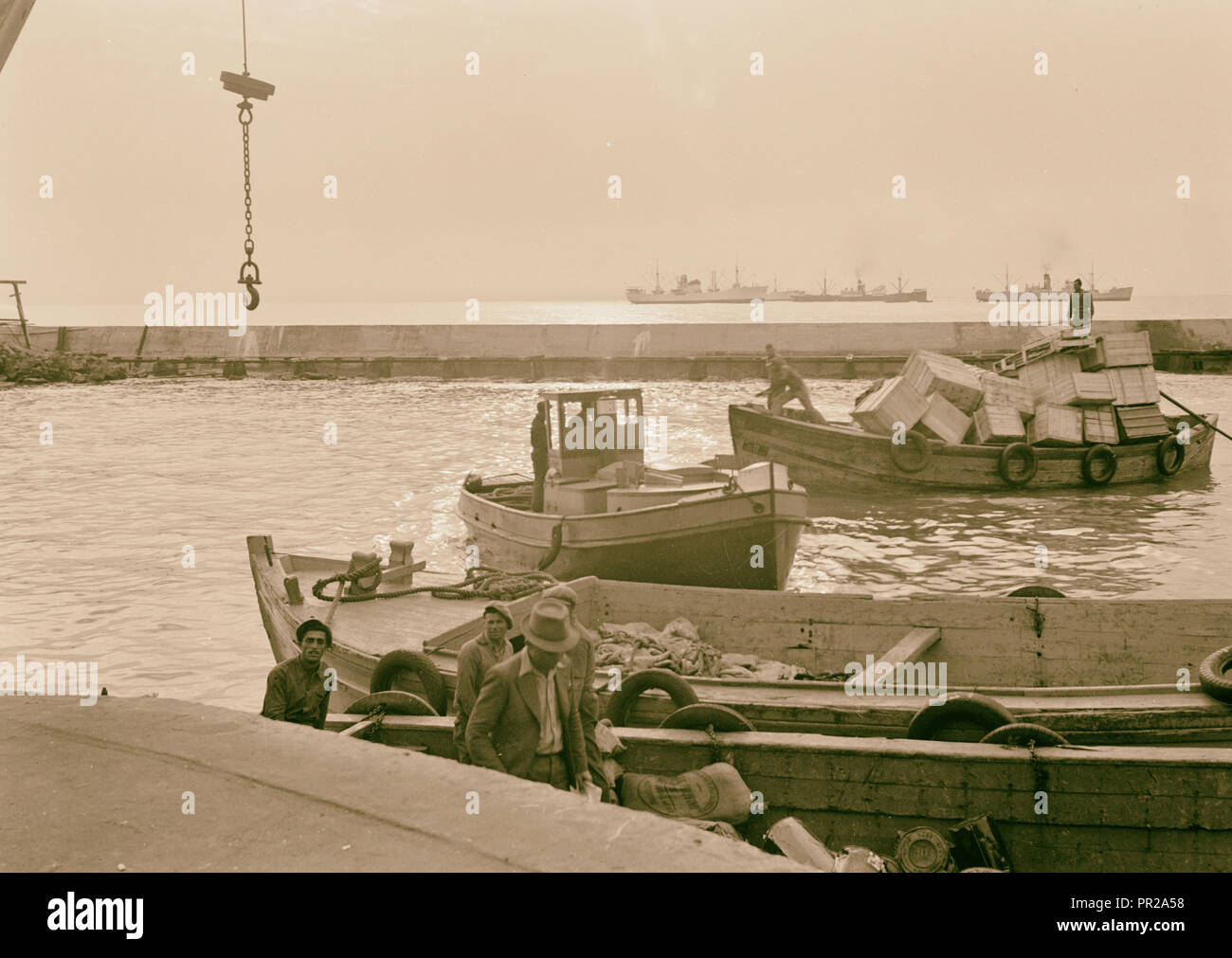 Tel Aviv Harbour. Setting sun, looking across lighter basin. 1939 ...