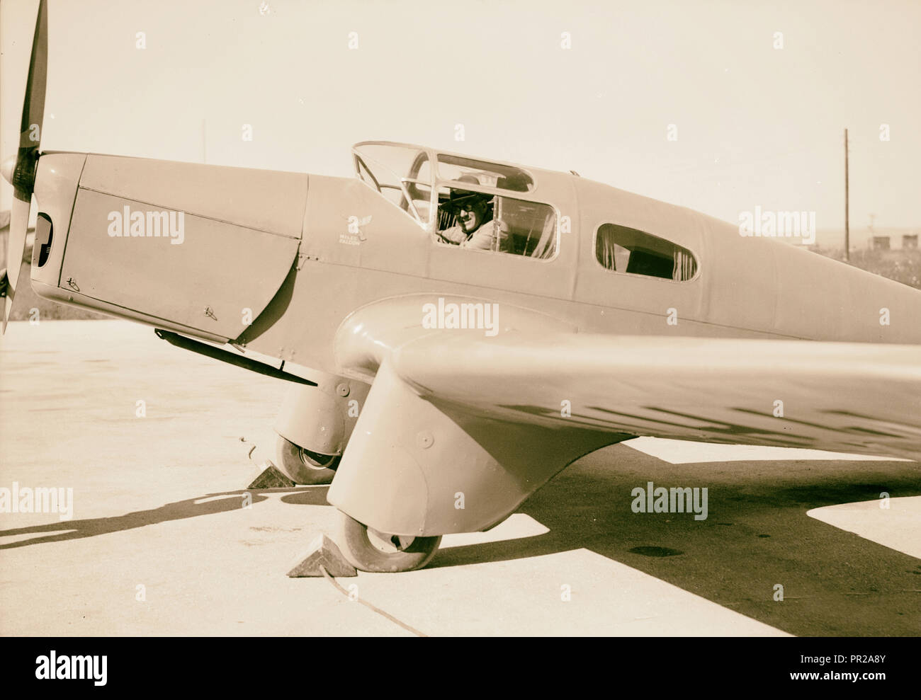 Lydda Airport. Major Gumbly, with his private flying machine, closeup ...