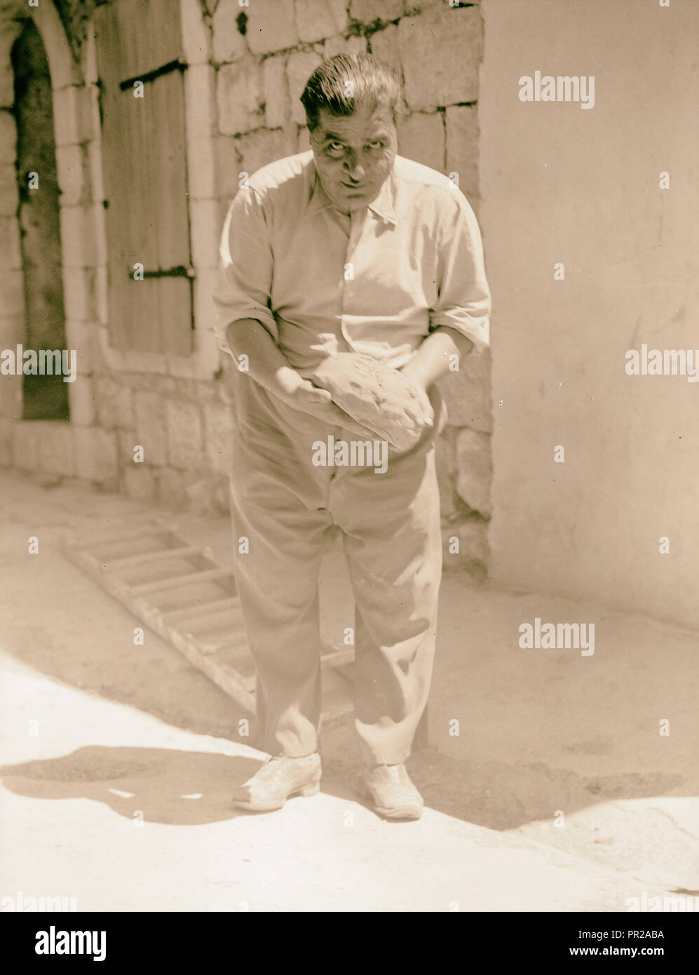 Loaf of clay mixed with powdered flint ready for use. 1934, Middle East ...