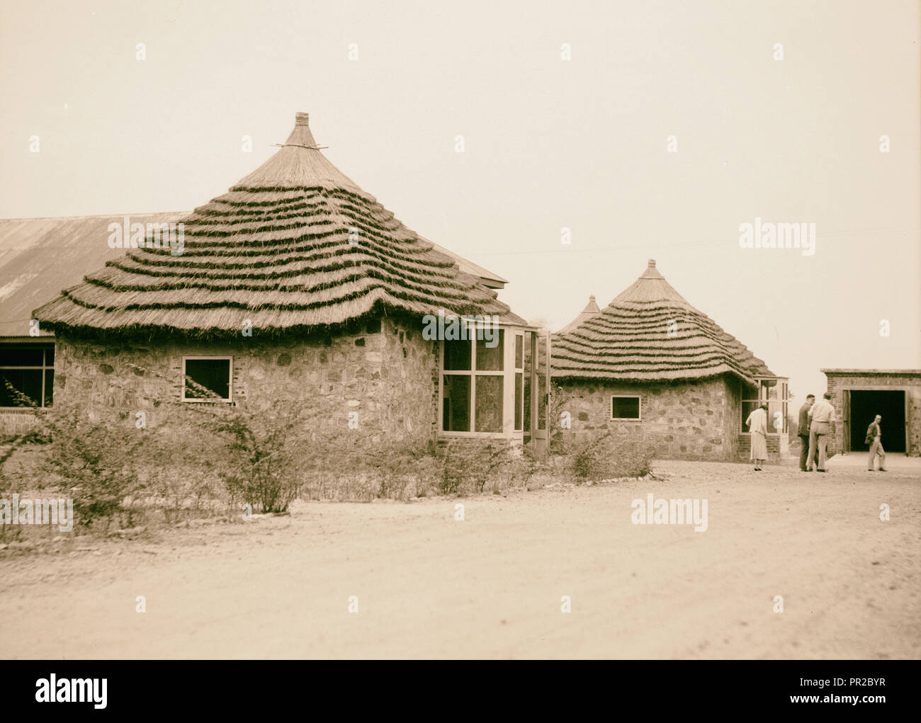 Sudan. Juba to southern border of Sudan. Straw-roofed hotel annexes ...