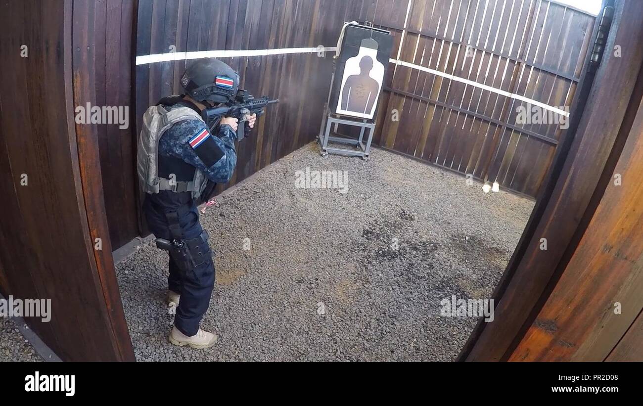 A Costa Rican competitor fires his weapon at a target July 22, 2017 ...