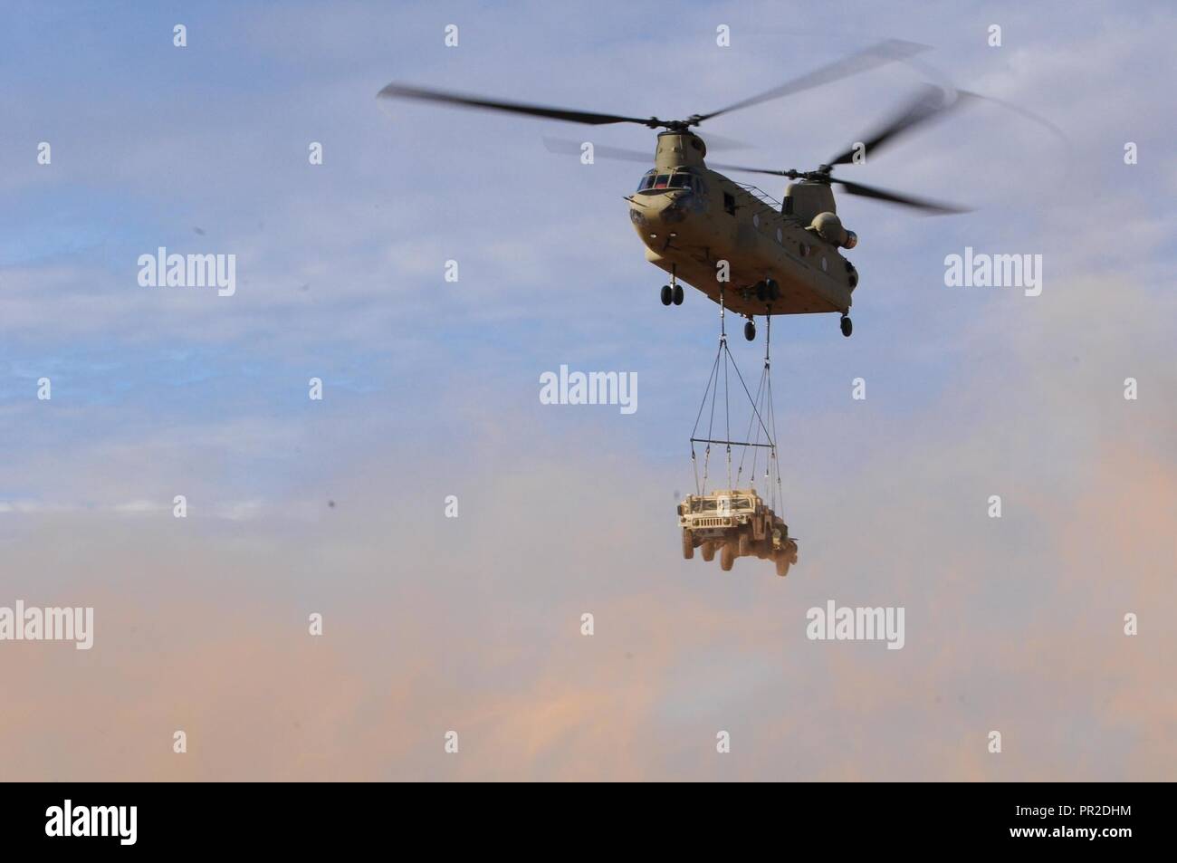 CH-47 Chinook transports a HUMVEE during a sling load operation as part of the Network ...