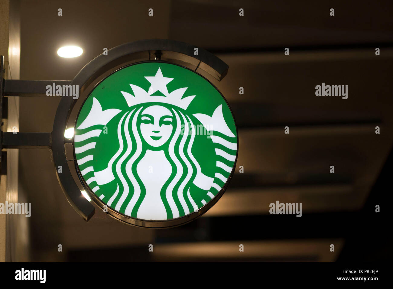 Starbucks coffee shop sign Stock Photo - Alamy