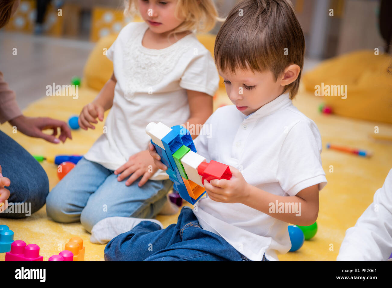 group of kids playing with constructor in kindergarten Stock Photo - Alamy