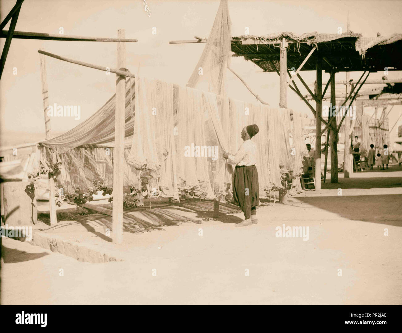 Syria. Tyre to Tripoli and Krak de Chevalier. Sidon. Fisherman drying ...