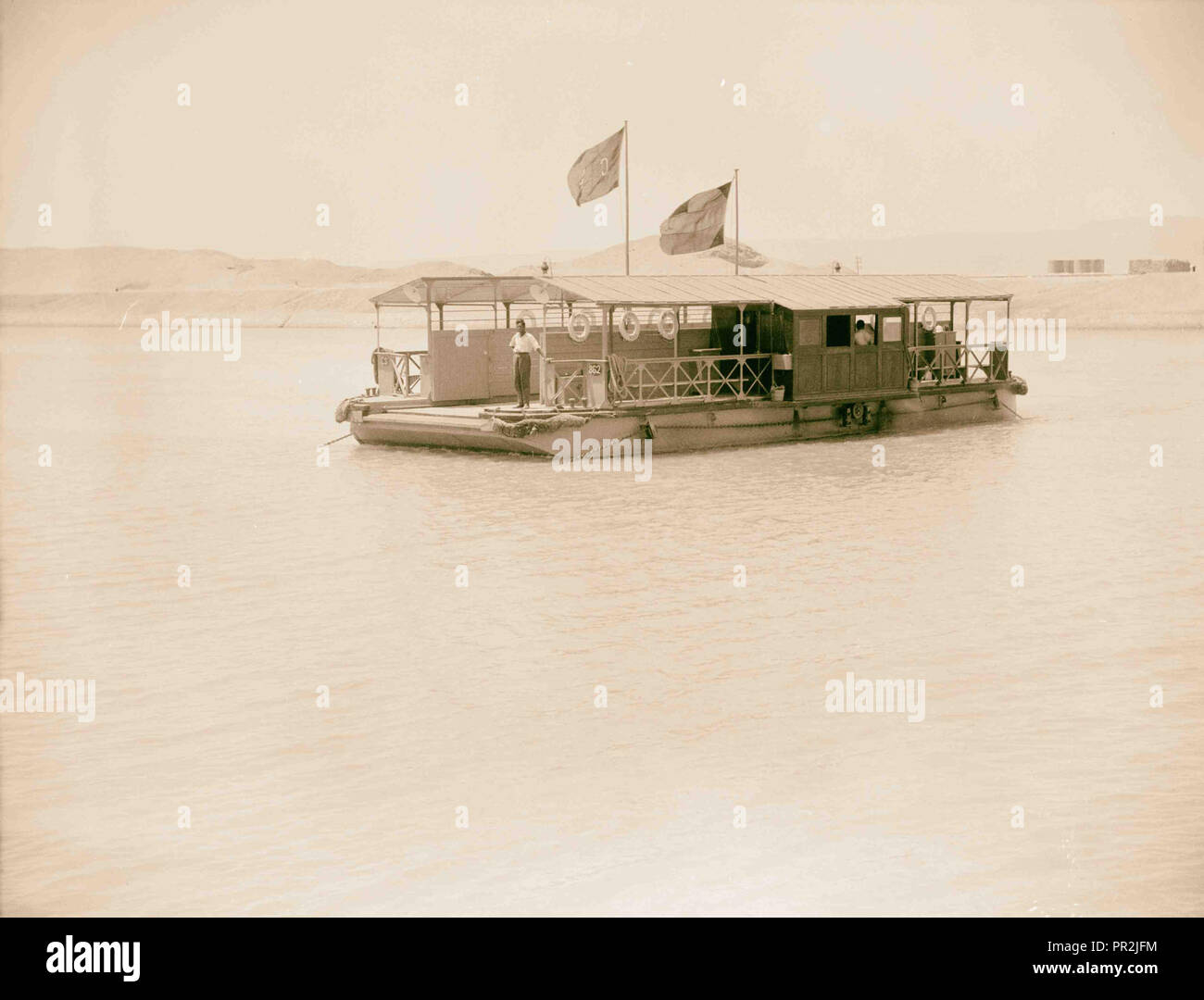 To Sinai by car. The Suez Canal. The Coubri ferry. 10 kilometers N. of ...