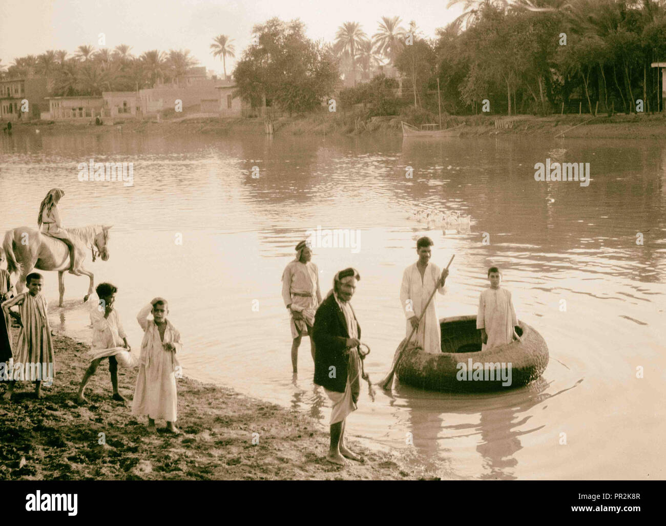 Iraq. River scenes on the Euphrates taken at Hilla. A river scene with ...