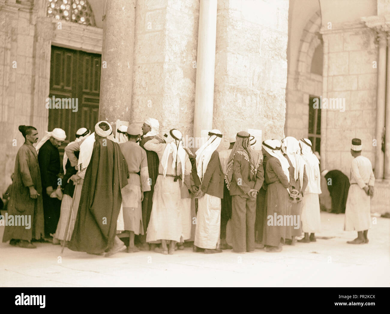 Groups of Arabs before al-Aqsa Mosque reading rebel posters. Friday ...