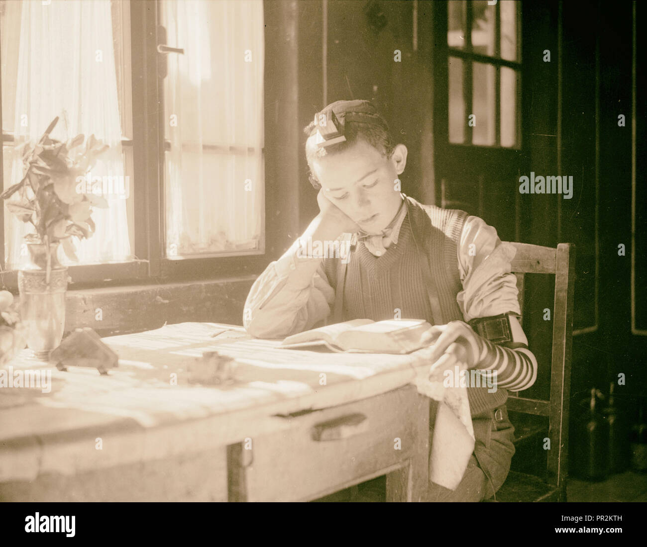 Askenazim, Ashkenazi Jewish youth studying his Torah with phylacteries ...