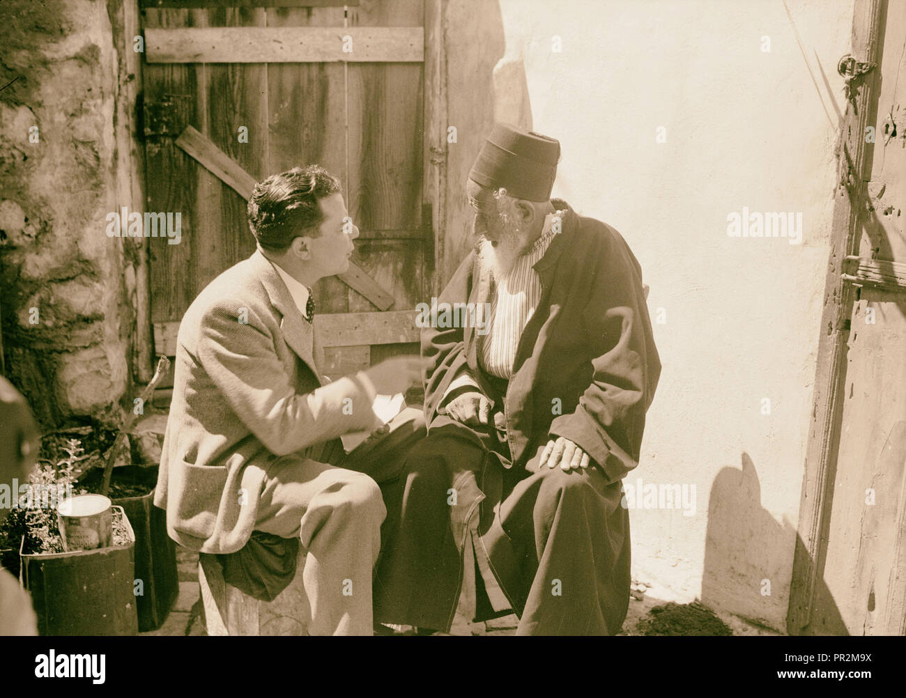 Rabbi Shlomo, speaking to Jacob Simon. 1934, Israel Stock Photo - Alamy