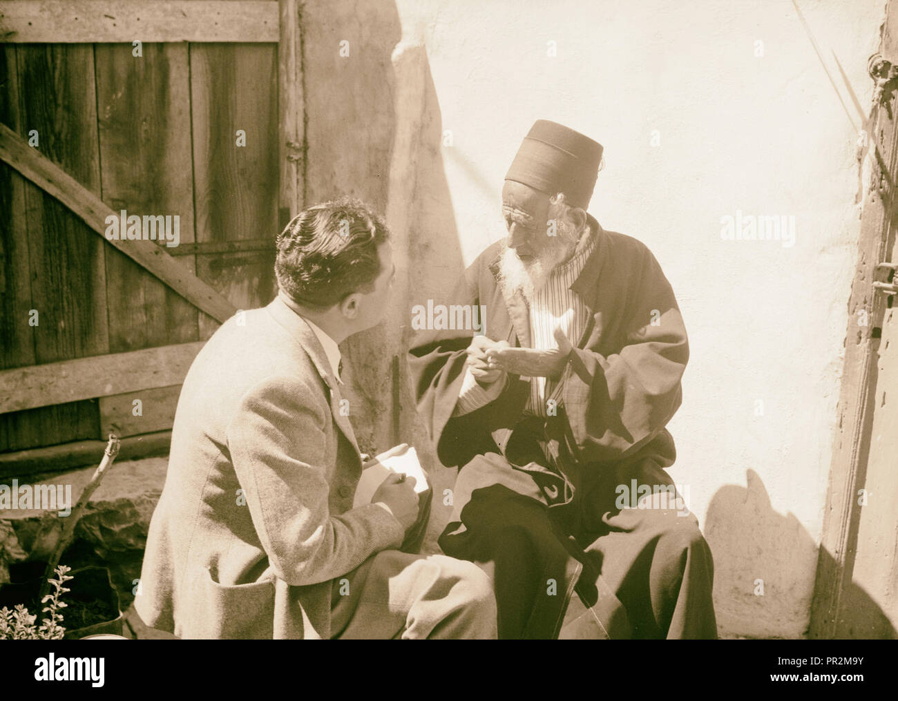 Rabbi Shlomo, speaking to Jacob Simon. 1934, Israel Stock Photo - Alamy