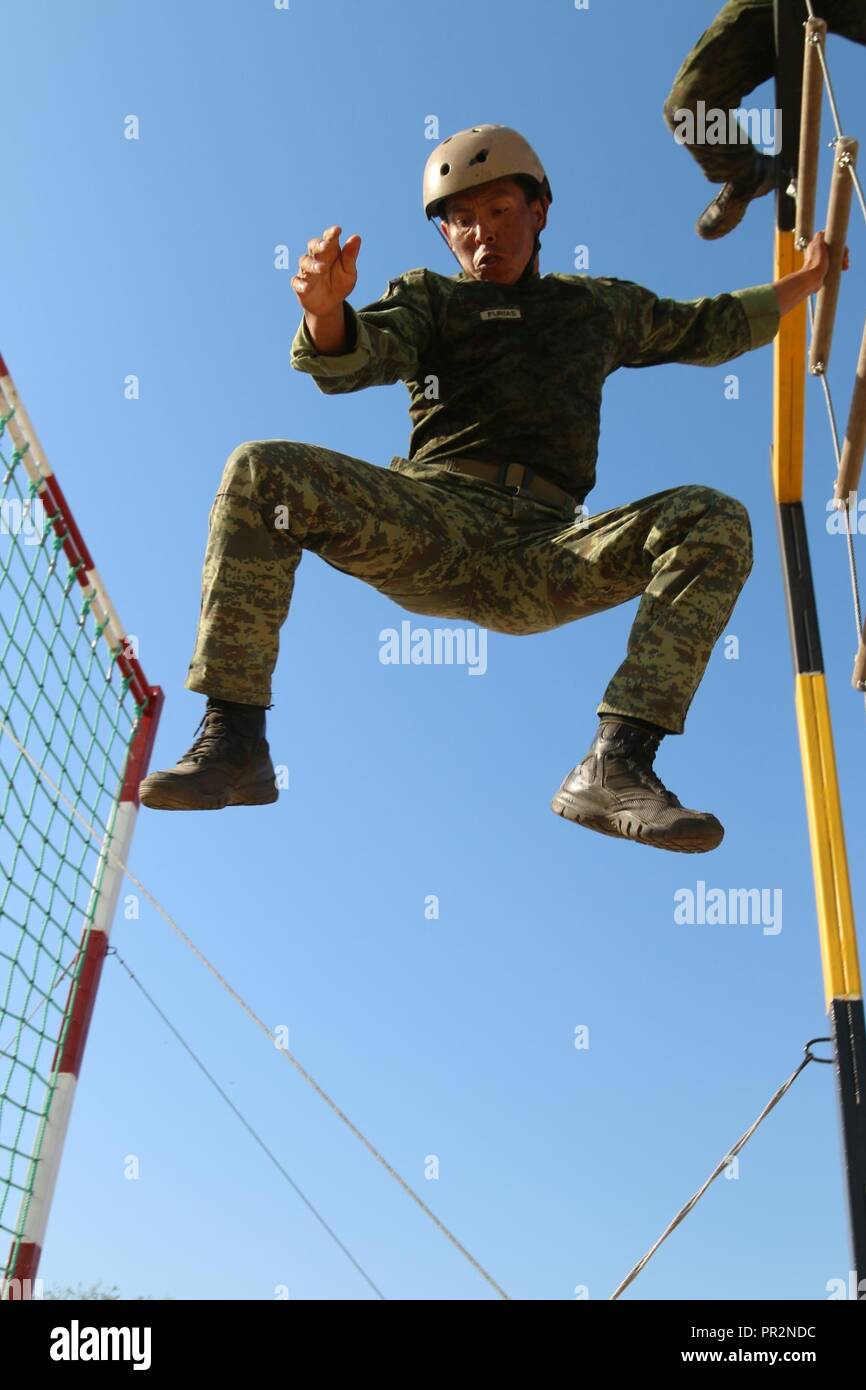 A Mexican competitior drops 15 feet off a ladder during the grueling ...