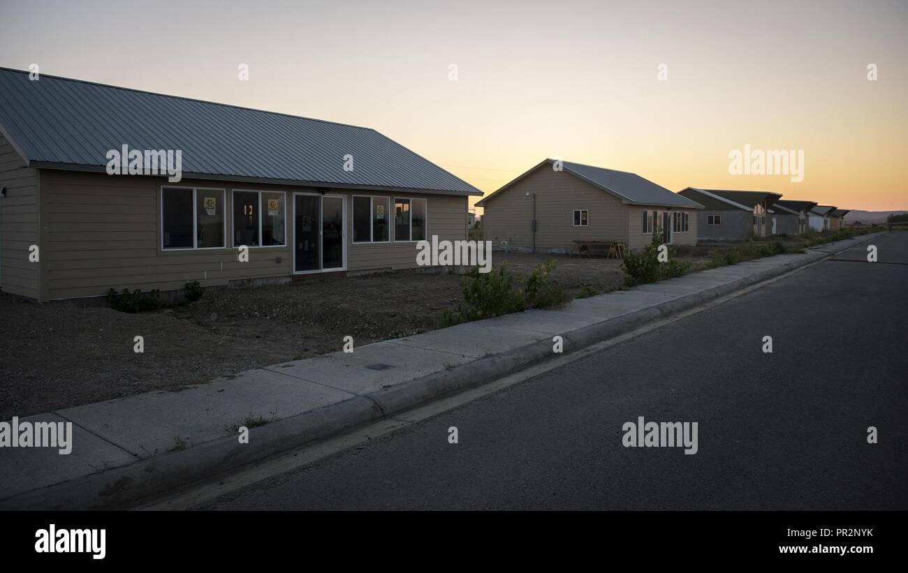 The sun rises over the Montana Crow Tribe Housing 2017 project site on ...