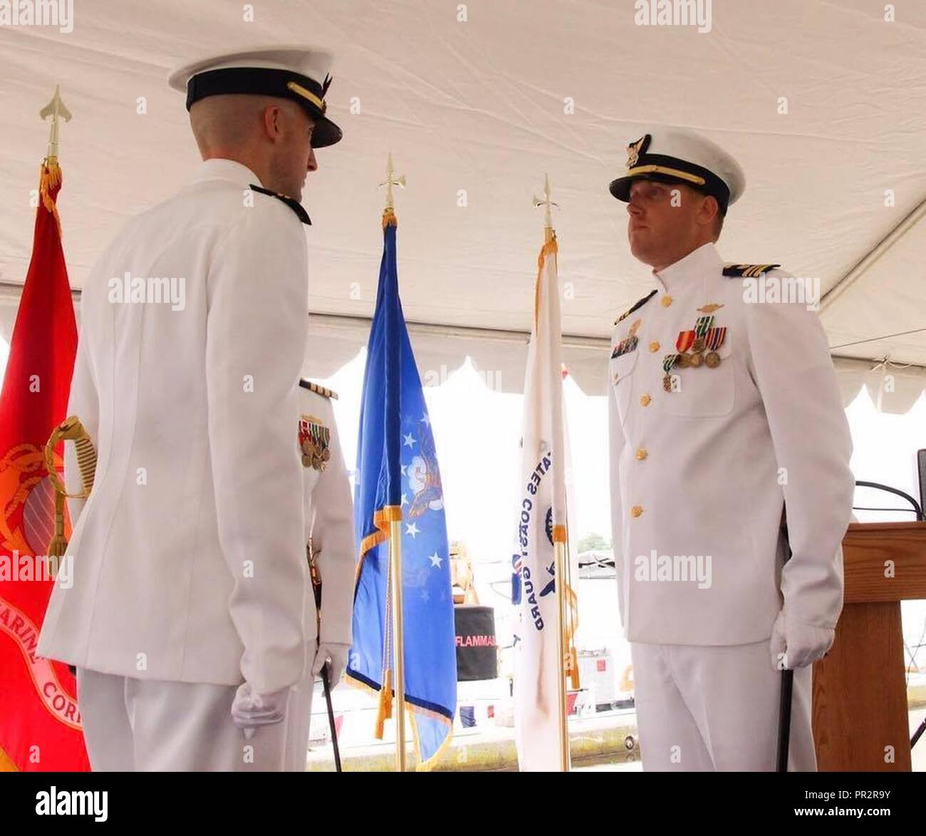 Coast Guard Lt. Patrick Powers (left) relieves Lt. Cmdr. David Stutt ...