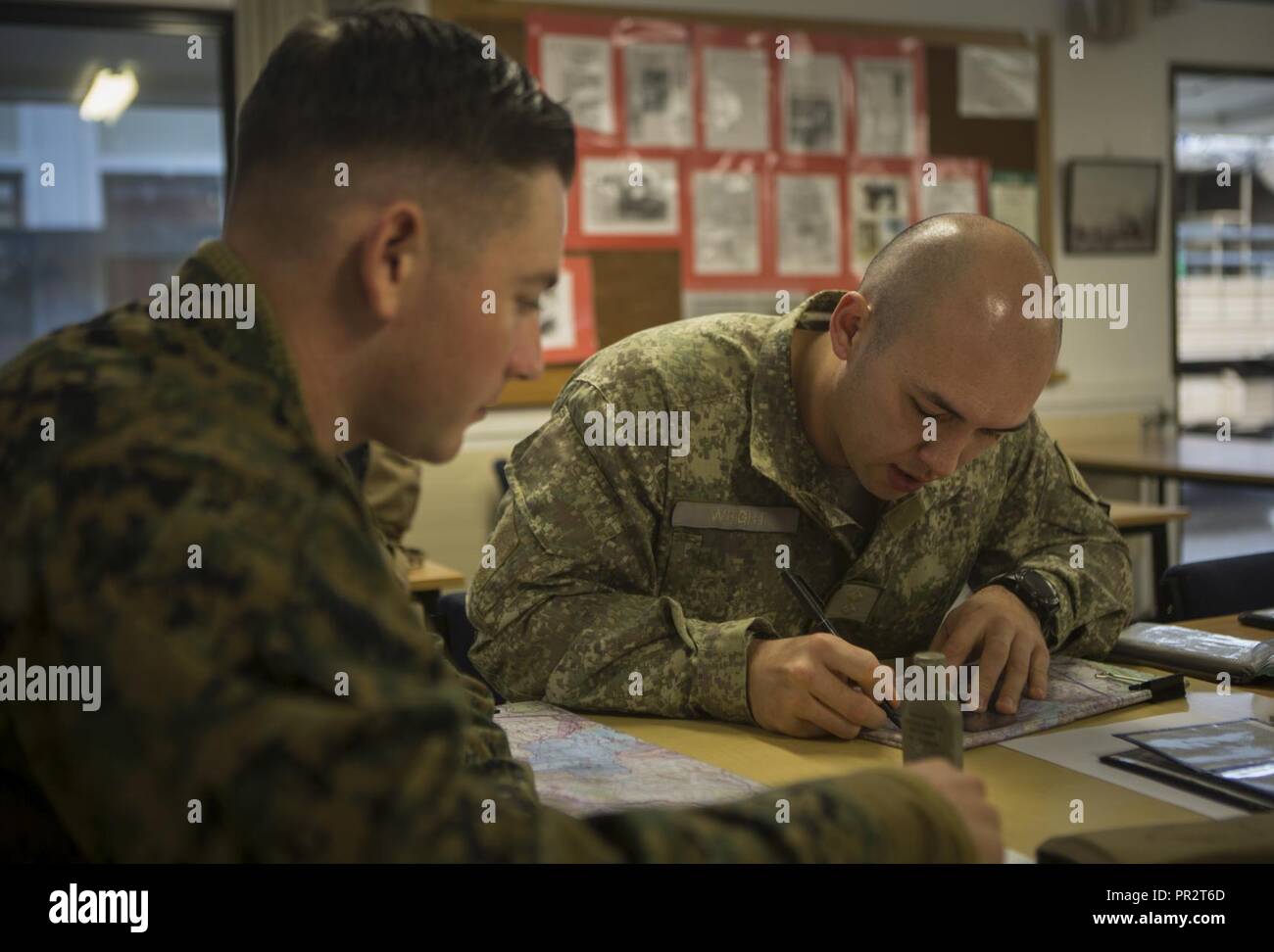 U.S. Marine Cpl. Hunter Badgett conducts a mock fire mission with Royal ...