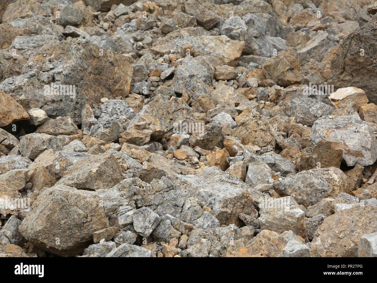 stones and solid rock of a landslide in mountain Stock Photo - Alamy