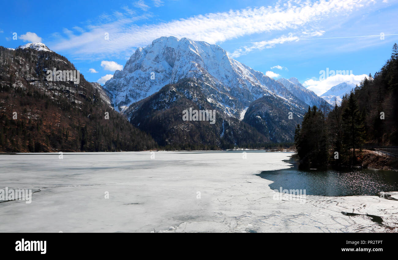 Mountains and the lake of Predil with ice in Northern Italy Stock Photo ...