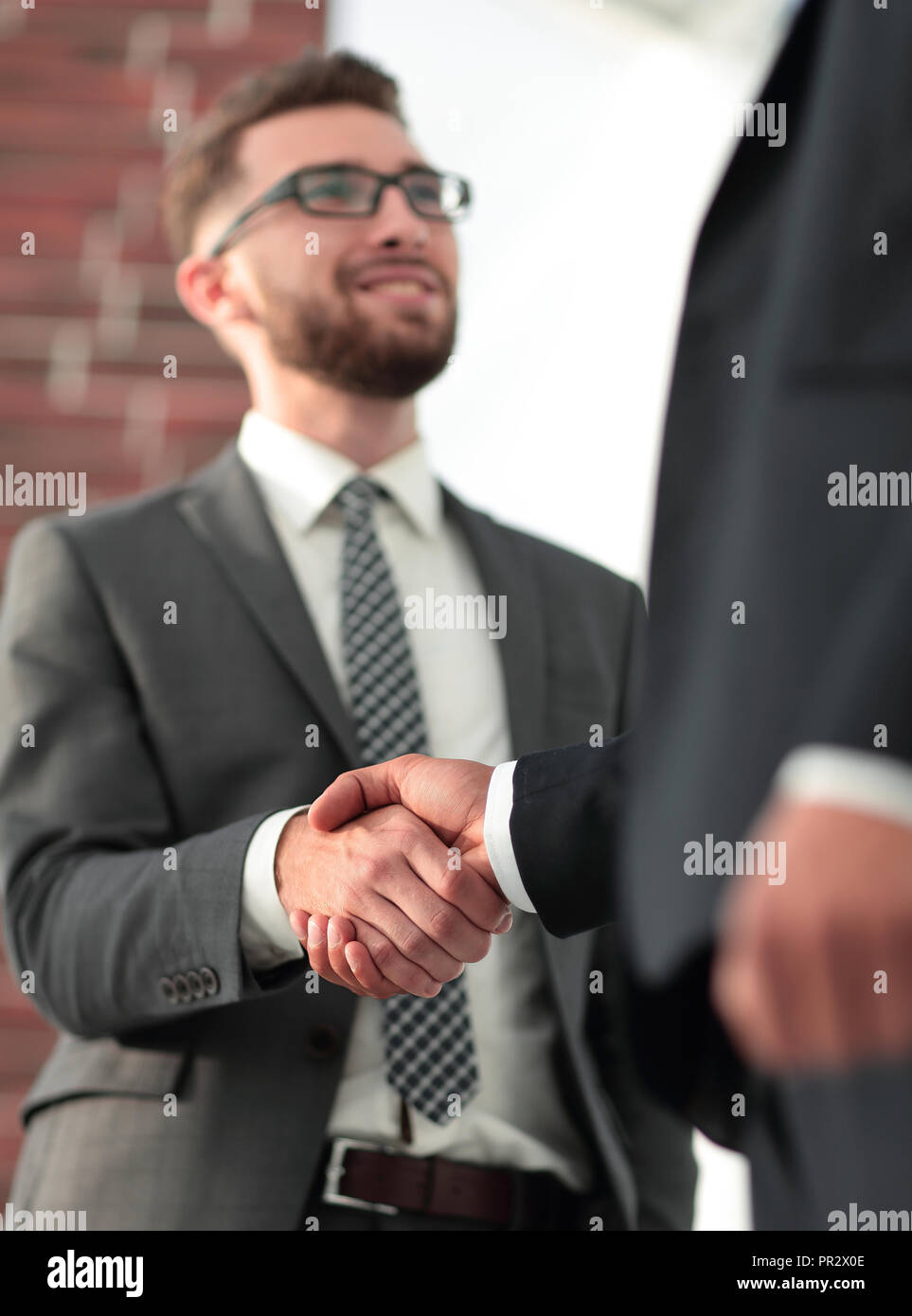 Business men giving a handshake. Business concept Stock Photo - Alamy