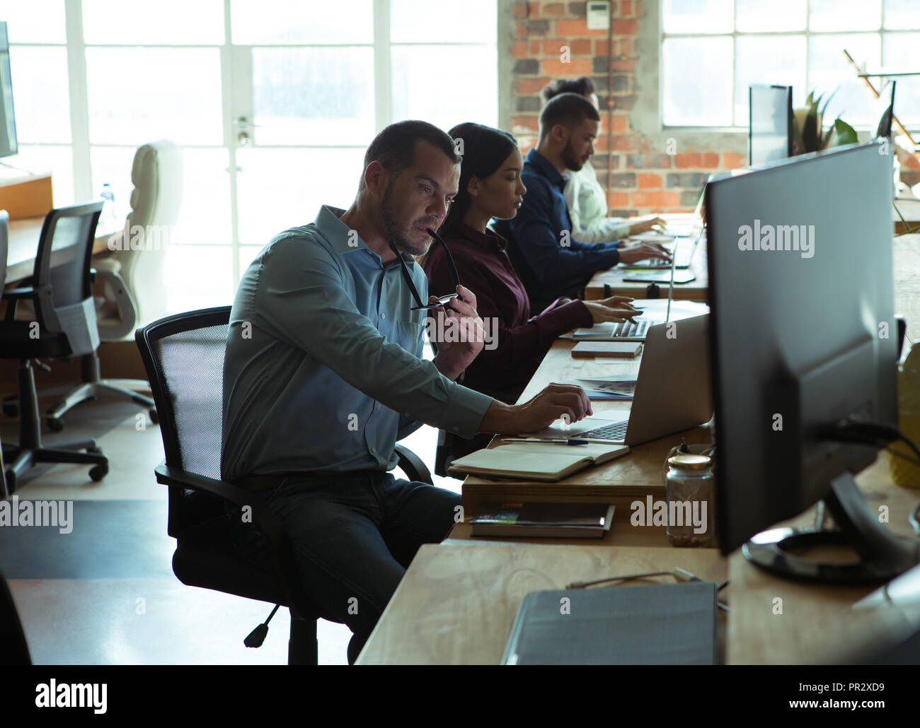 Executives working desk in office hi-res stock photography and images ...