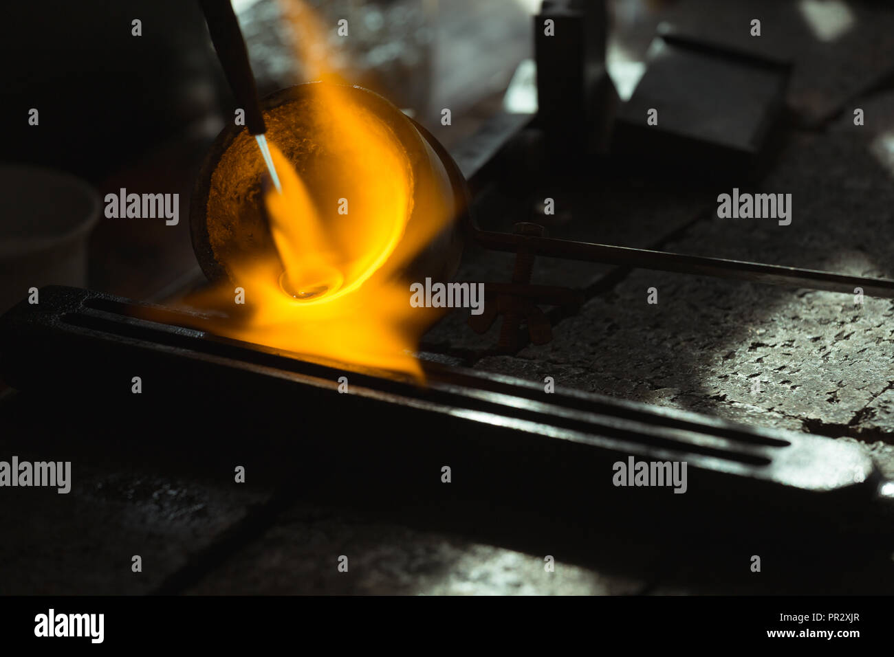 Metal being heated in workshop Stock Photo - Alamy
