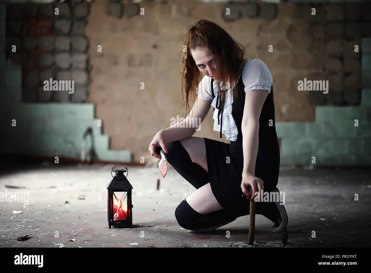 A young girl in the blood and with a knife Stock Photo - Alamy