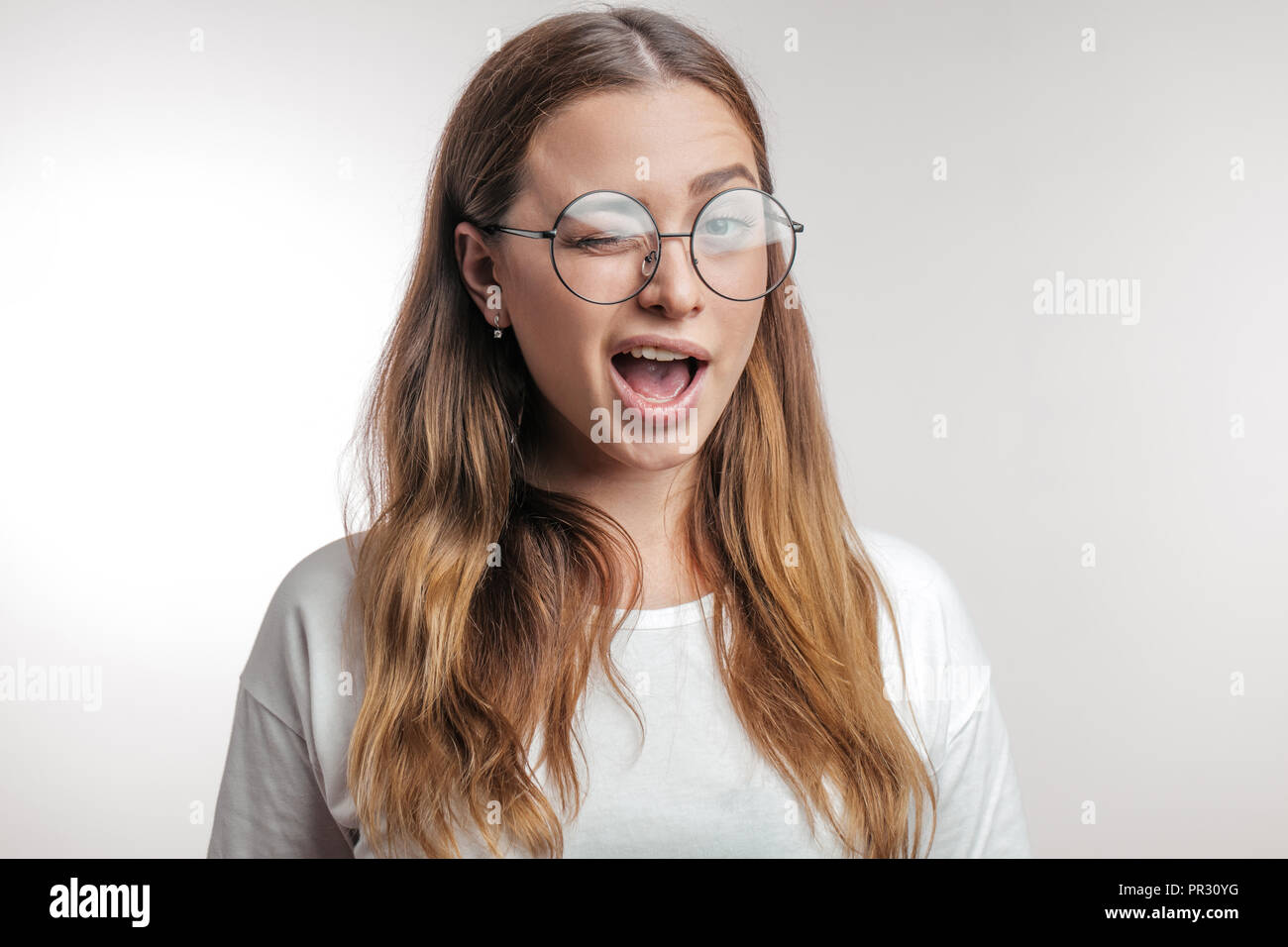 Woman blinking eyes hi-res stock photography and images - Alamy