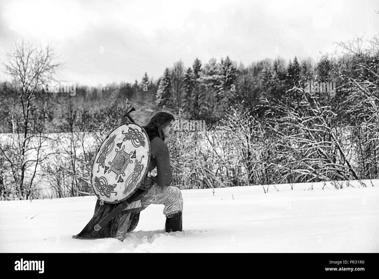 Defender the young warrior in armor Stock Photo - Alamy