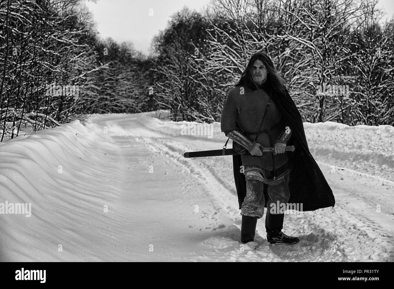 Defender the young warrior in armor Stock Photo - Alamy