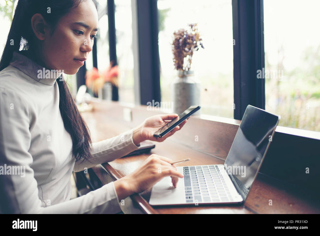business women using smartphone for work Stock Photo - Alamy