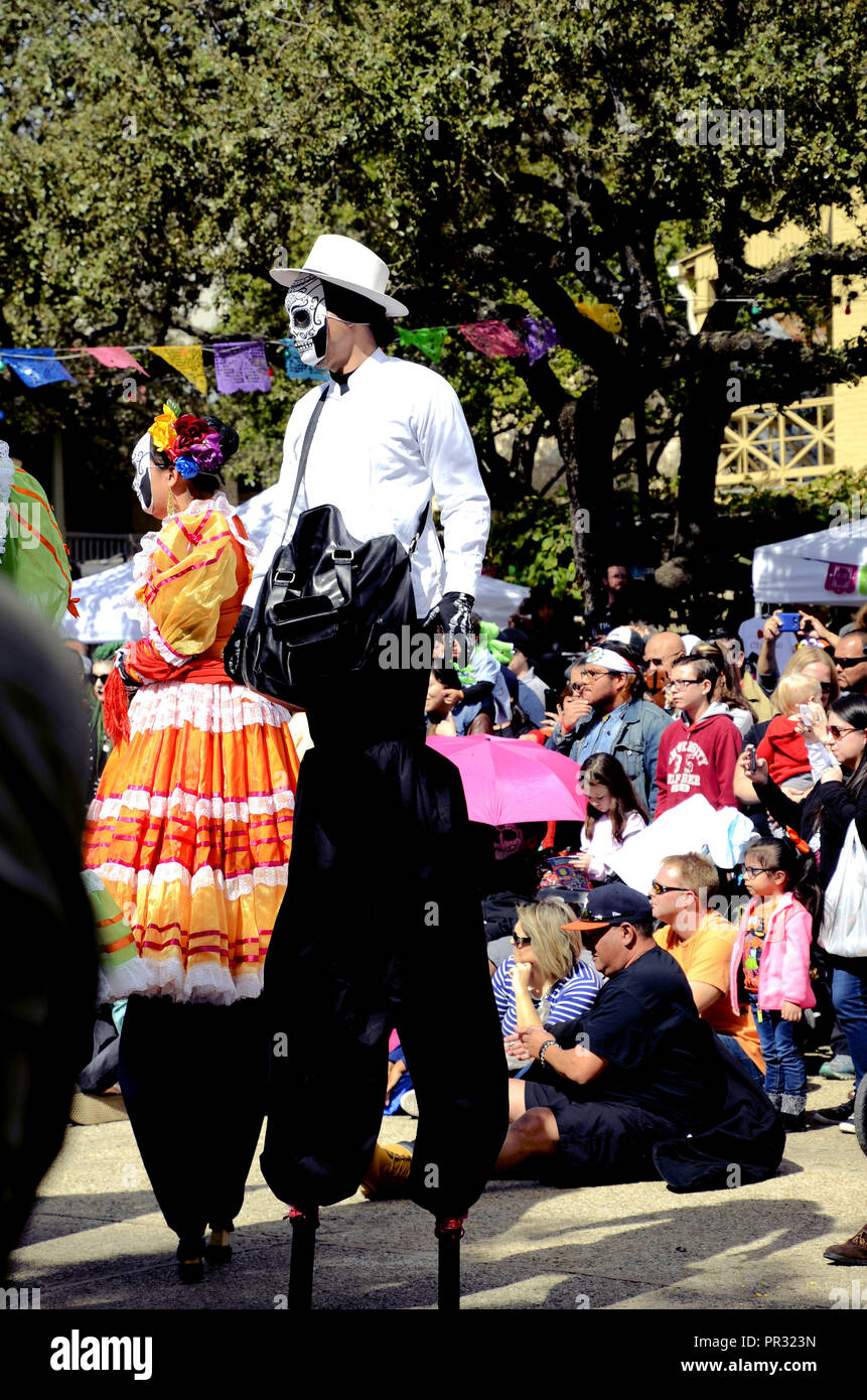 Couple in skeleton masks and stilts; Day of the Dead Celebration in San ...