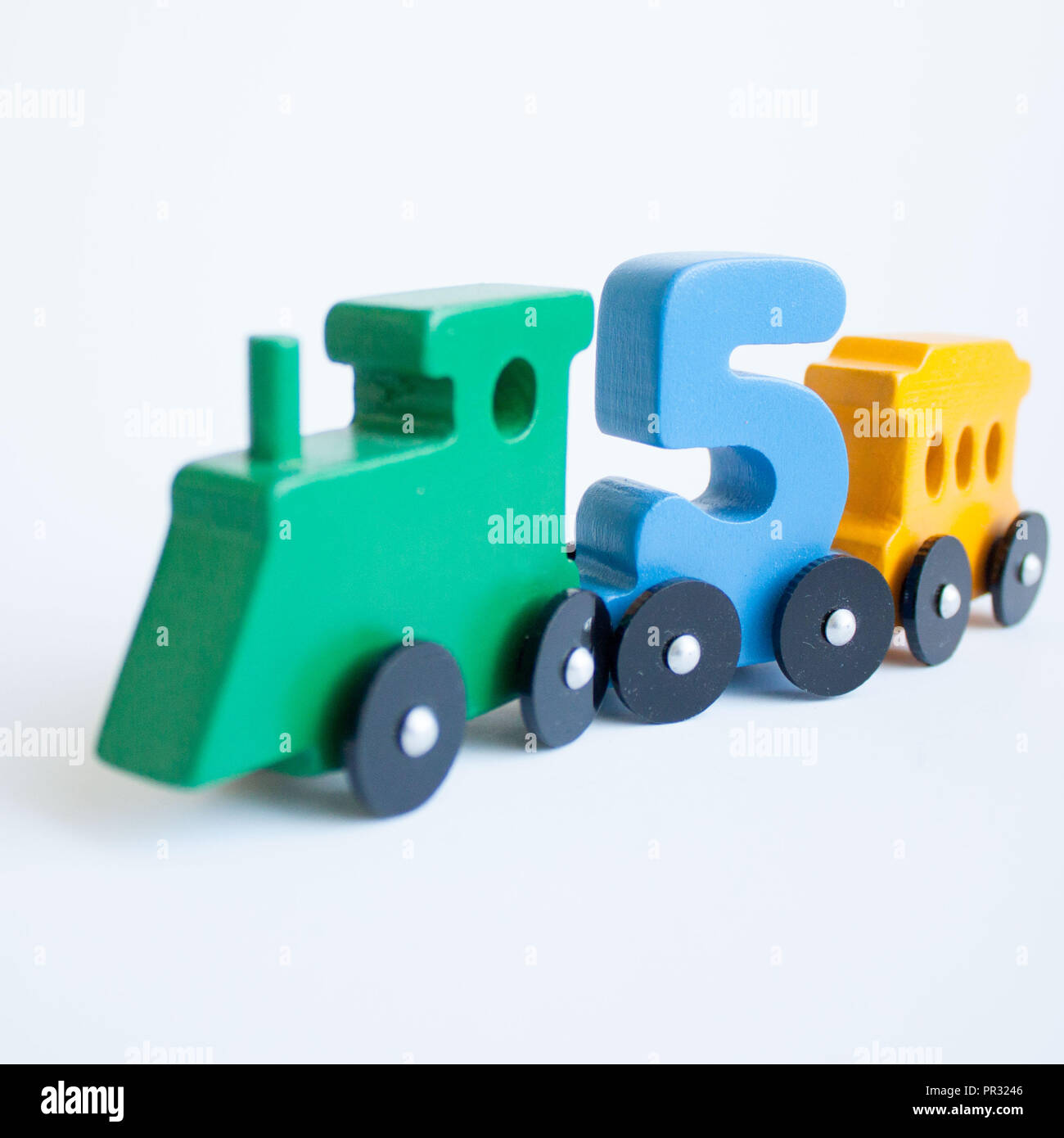 wooden letters train alphabet number 5. Bright colors of red yellow ...