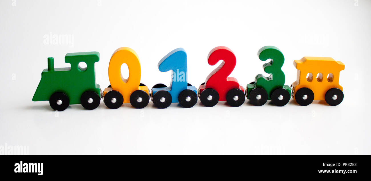 wooden numbers 0,1,2,3 letters train alphabet . Bright colors of red ...