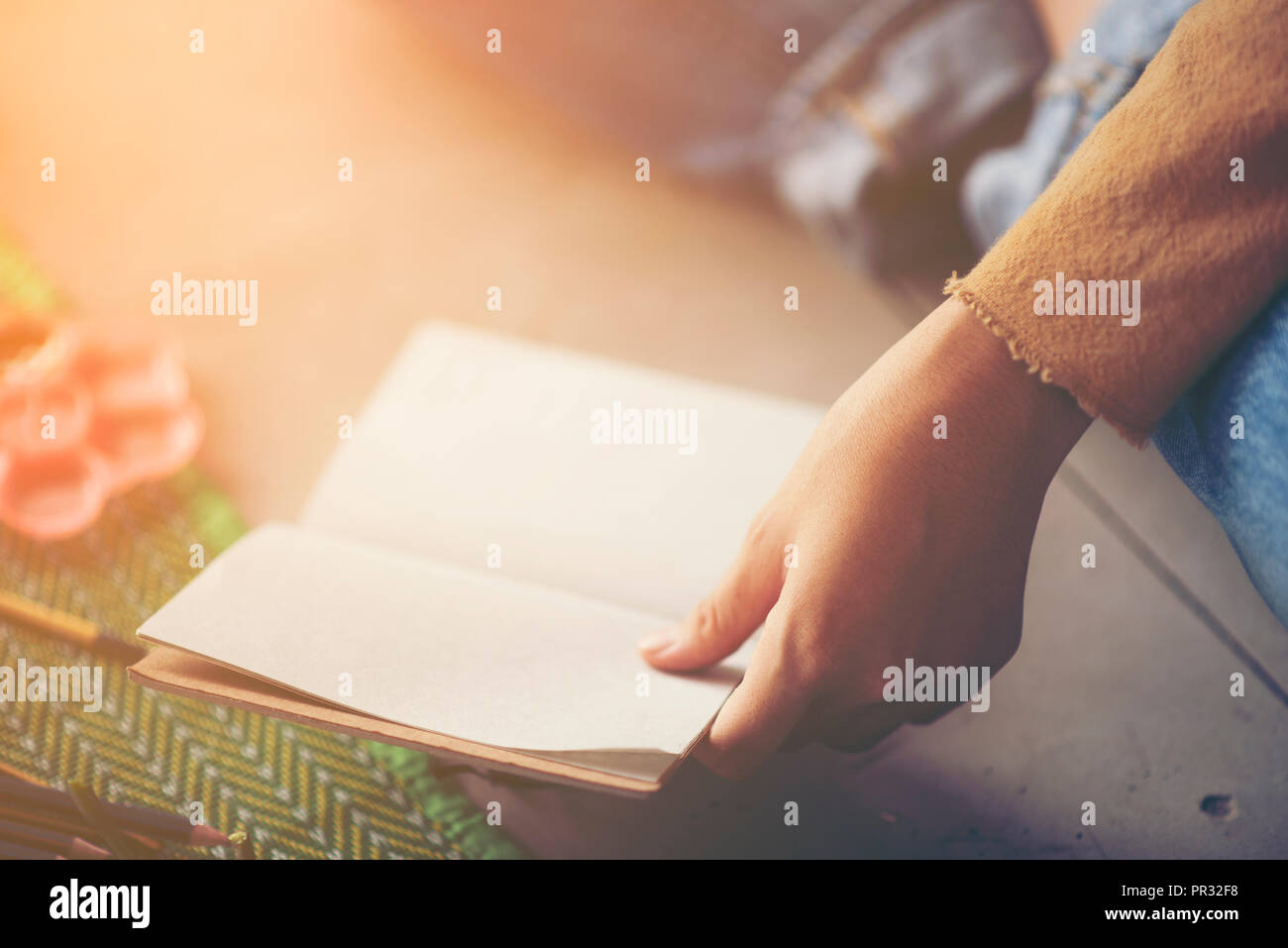 artist hands drawing on a book Stock Photo - Alamy