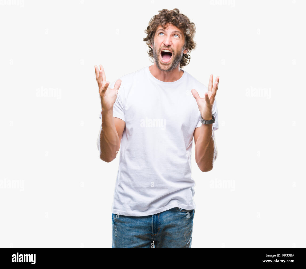 Handsome hispanic model man over isolated background crazy and mad ...