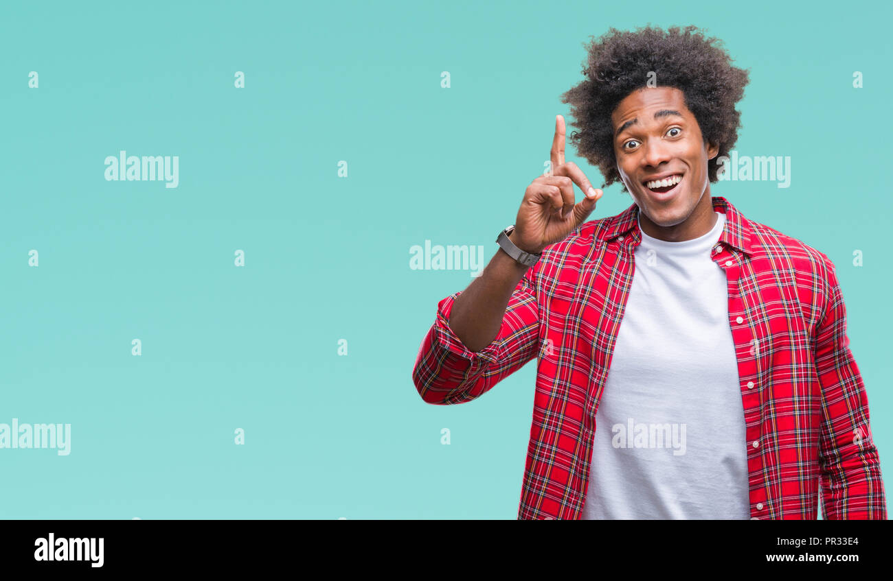 Afro american man over isolated background pointing finger up with ...
