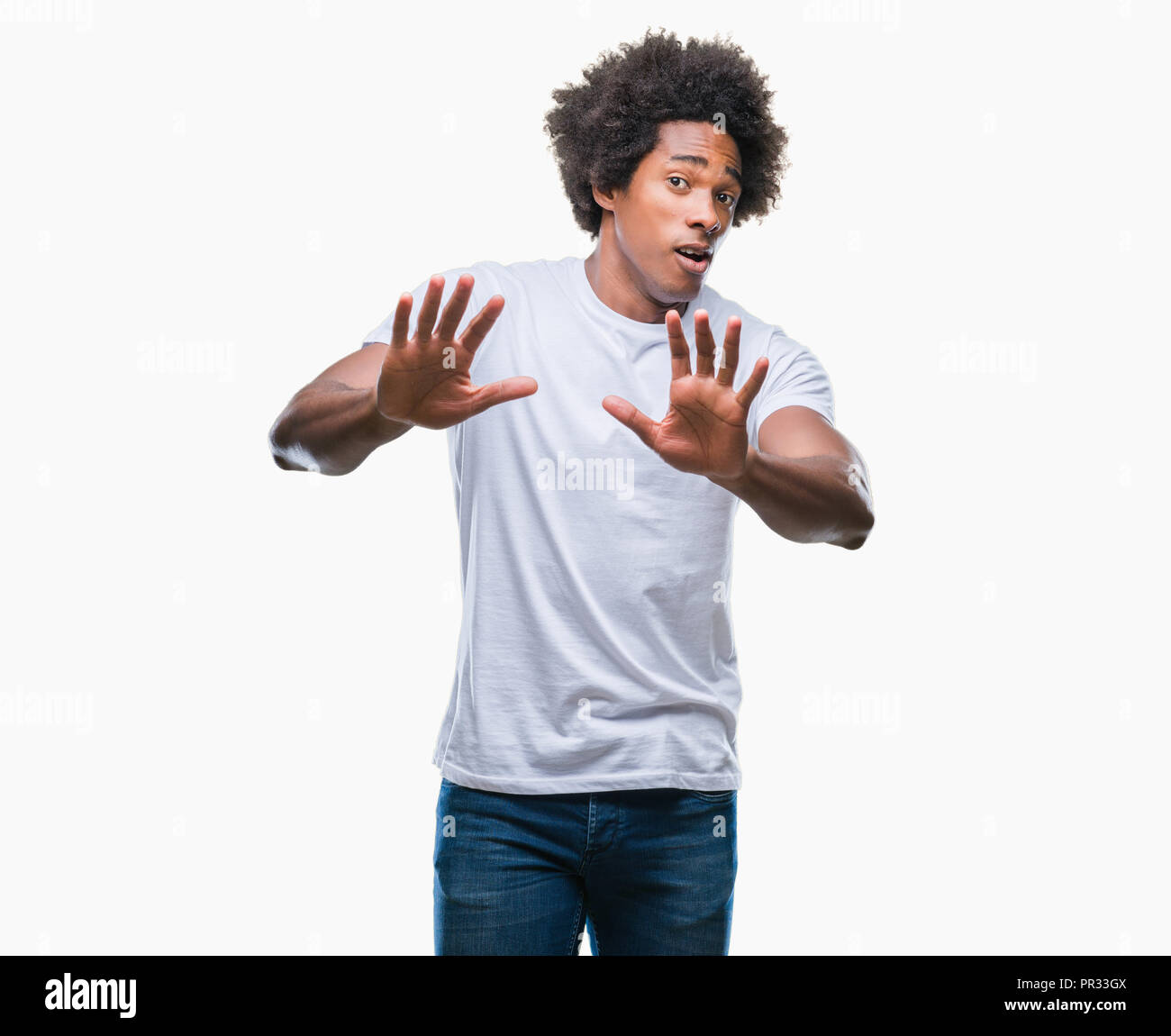 Afro american man over isolated background afraid and terrified with ...