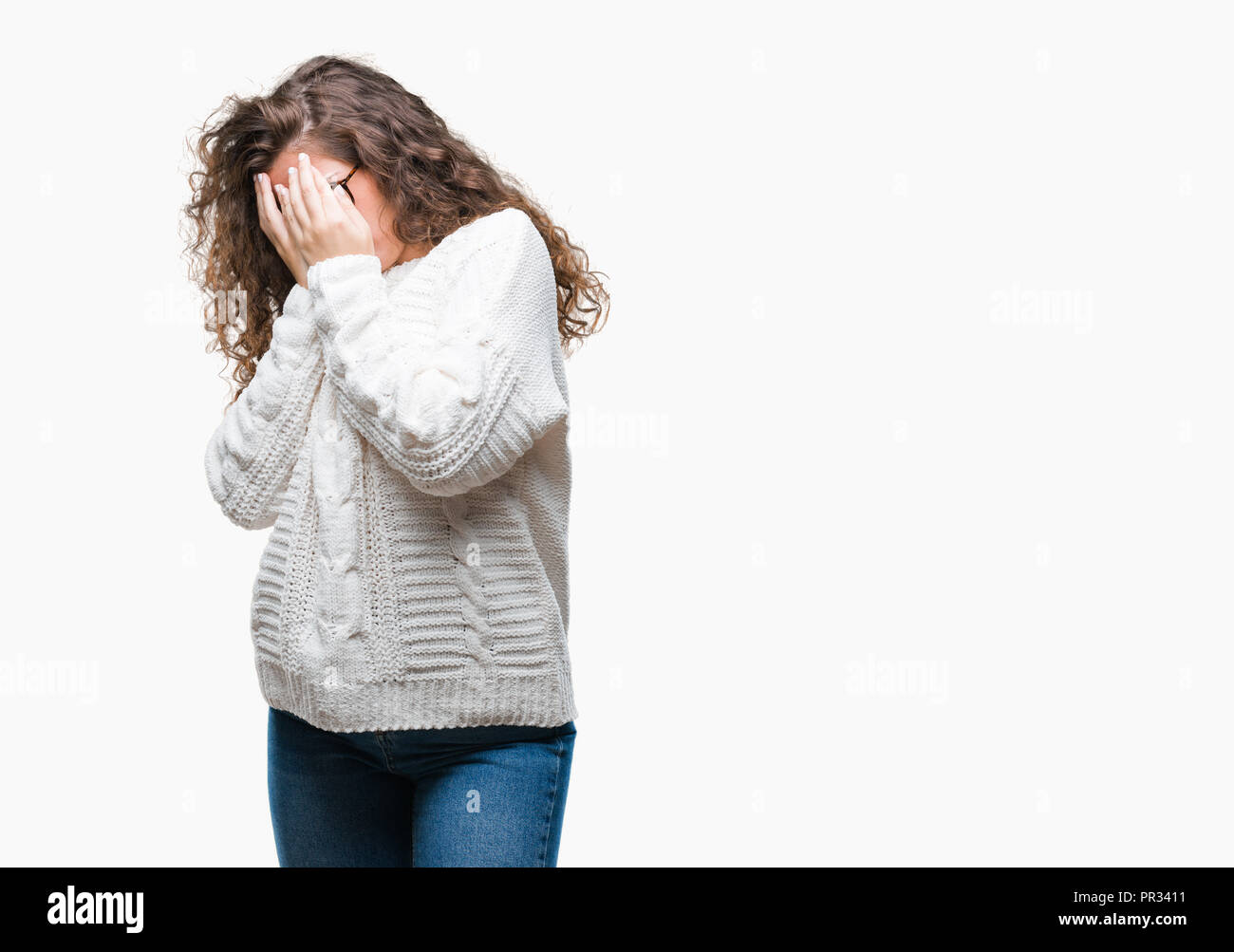 Beautiful brunette curly hair young girl wearing winter sweater over ...
