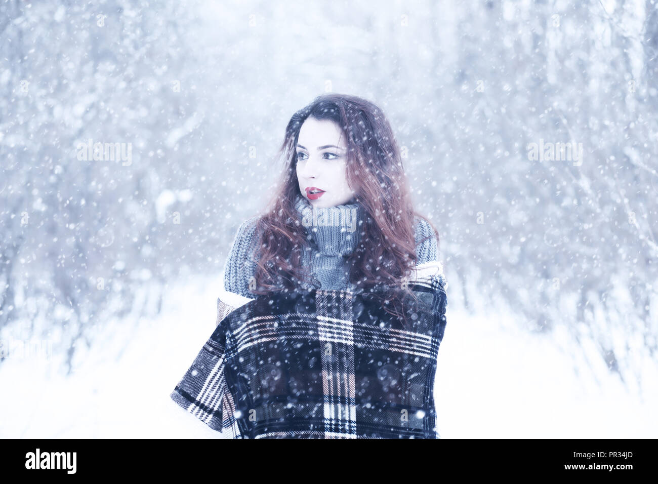 Beautiful girl in a beautiful winter snow Stock Photo - Alamy