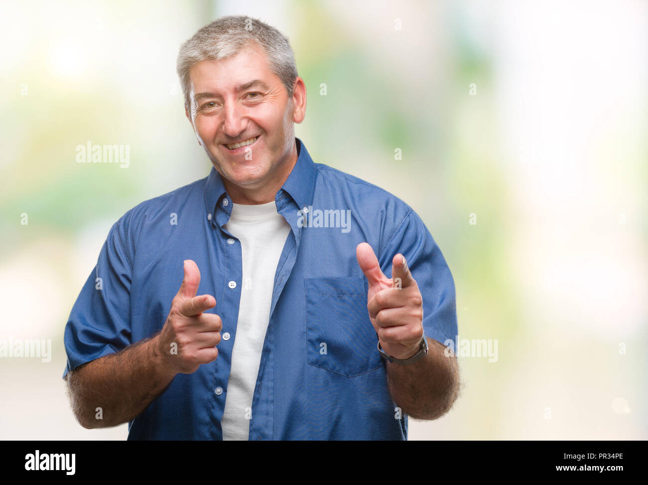 Handsome senior man over isolated background pointing fingers to camera ...