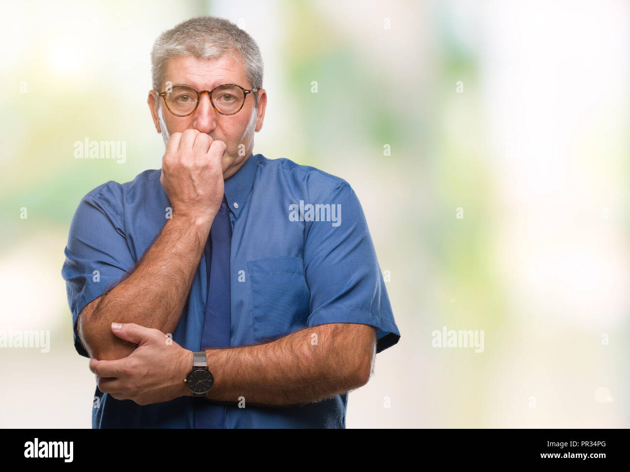 Handsome senior business man over isolated background looking stressed ...