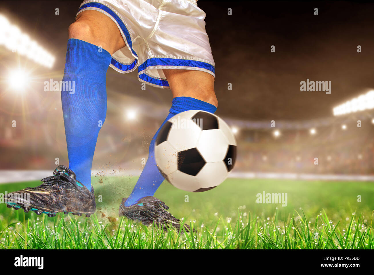 Football player kicking ball hi-res stock photography and images - Alamy