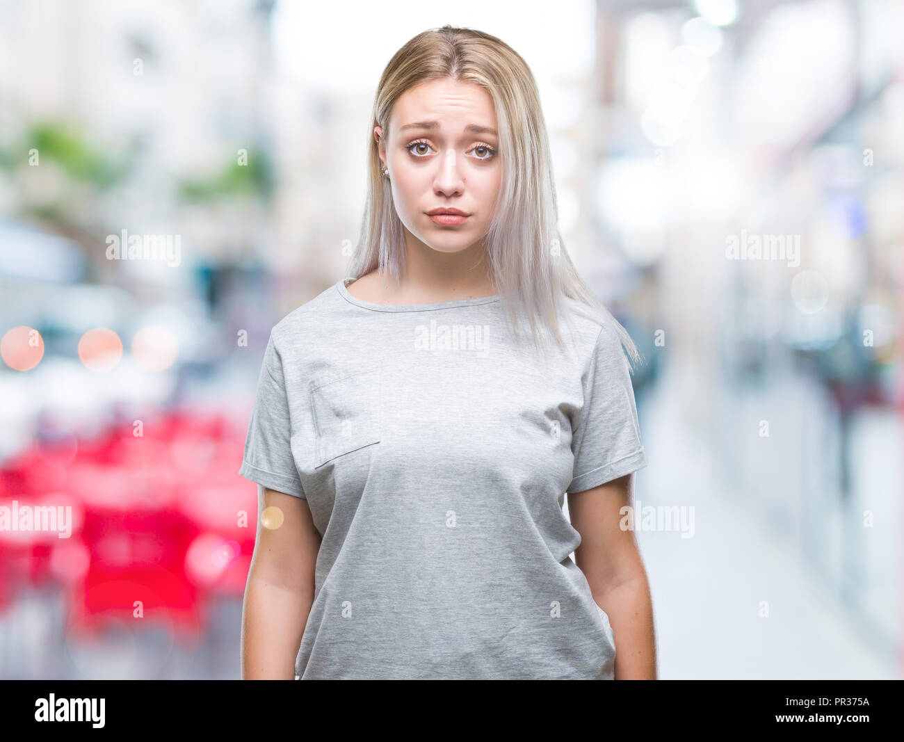 Young blonde woman over isolated background depressed and worry for ...
