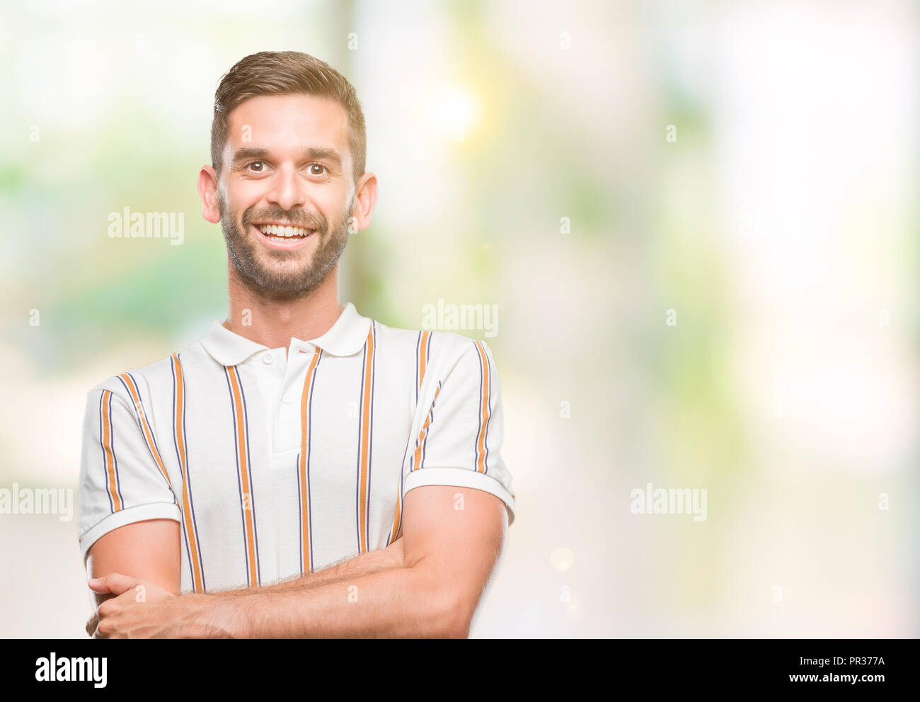 Young handsome man over isolated background happy face smiling with ...