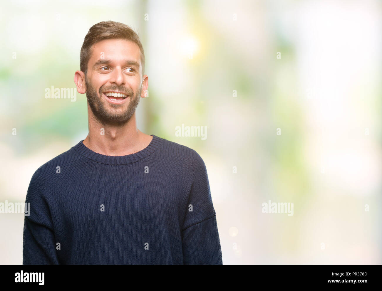 Young handsome man wearing winter sweater over isolated background ...
