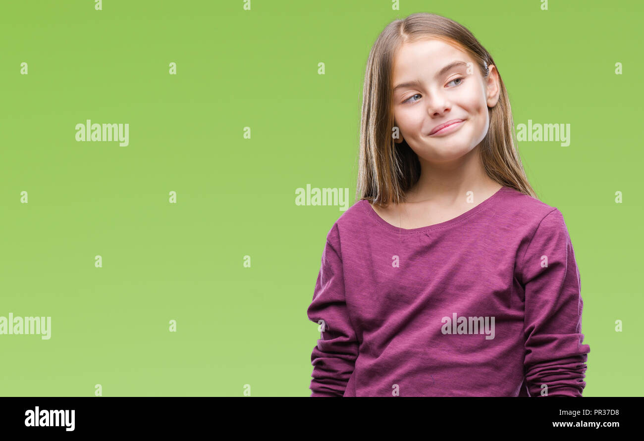 Young beautiful girl over isolated background smiling looking side and ...