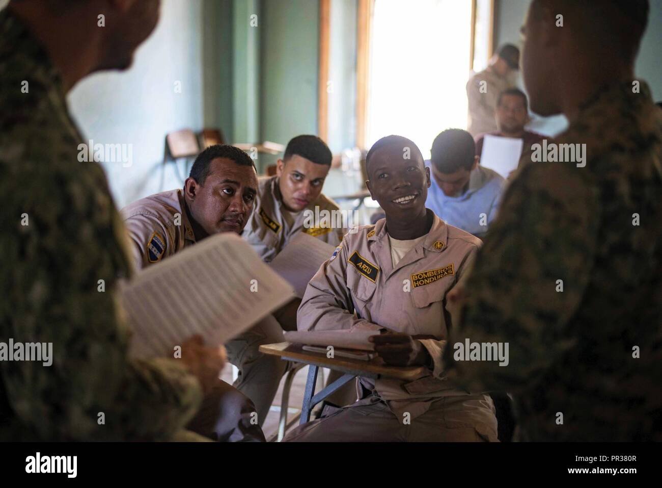 TRUJILLO, Honduras (July 31, 2017) Honduran firefighters look on, as ...